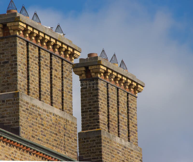 Multiple Yellow Brick Chimneys Stock Photo - Image of traditional ...