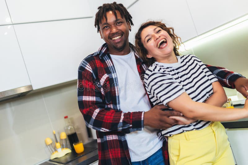 Couple Dancing Salsa in the Kitchen Stock Photo - Image of home, smile ...