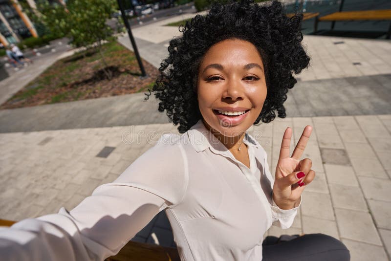 Multiracial Female Taking Selfie Showing Peace Sign Stock Image Image