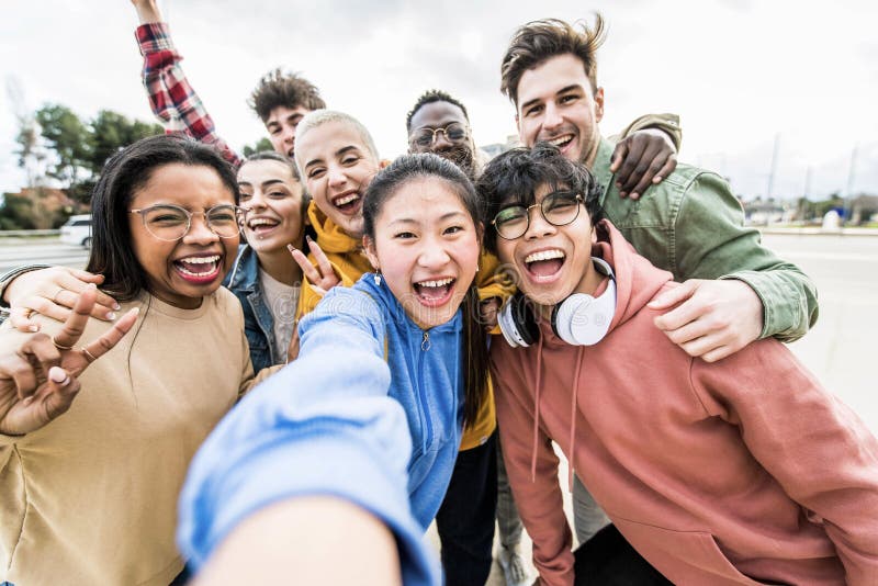 Multiracial Friends Taking Big Group Selfie Shot Smiling At Camera