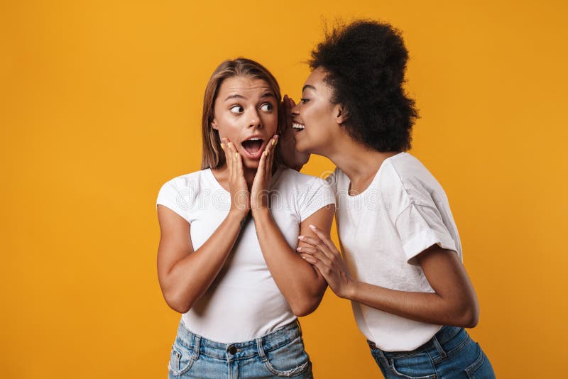 Multiracial Girls Wearing Party Cones Laughing While Posing With Cakes