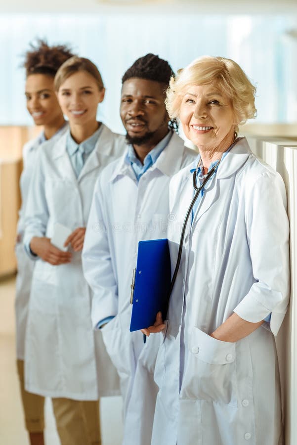 A Multiracial Group of Doctors in Lab Coats Standing in a Stock Image ...