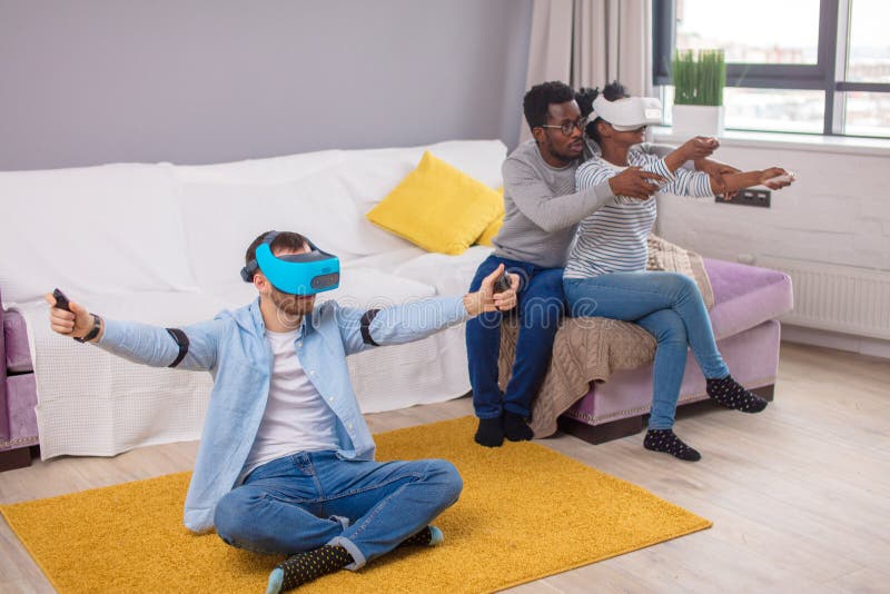 Multiracial Group of Friends Having Fun Trying on 3D Virtual Reality ...