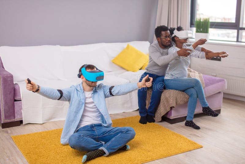 Multiracial Group of Friends Having Fun Trying on 3D Virtual Reality ...