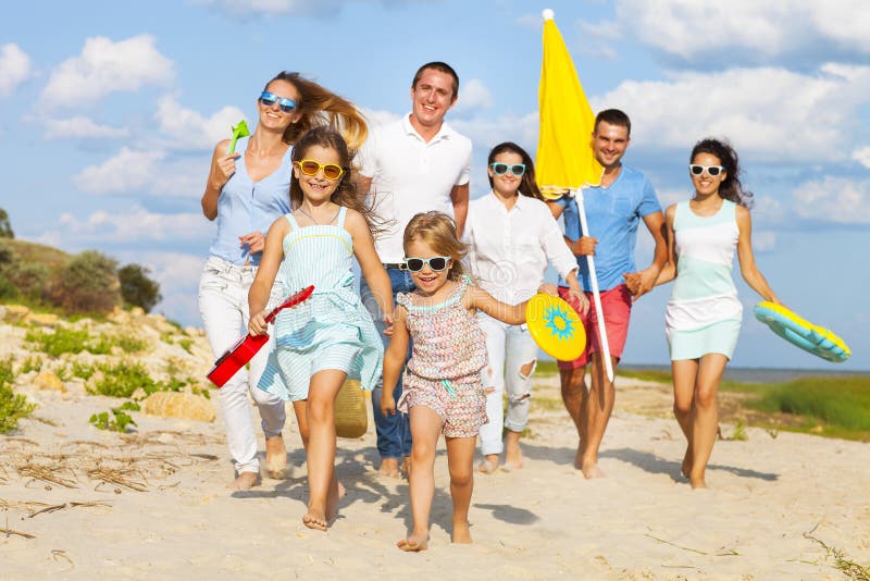 Multiracial Group of Friends Walking at the Beach Stock Photo - Image ...