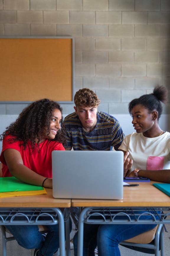 Multiracial Group of High School Students Doing Homework Research ...