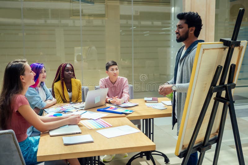 Multiracial Group Standing Near Wall and Put Sticky Sticker on Glass ...