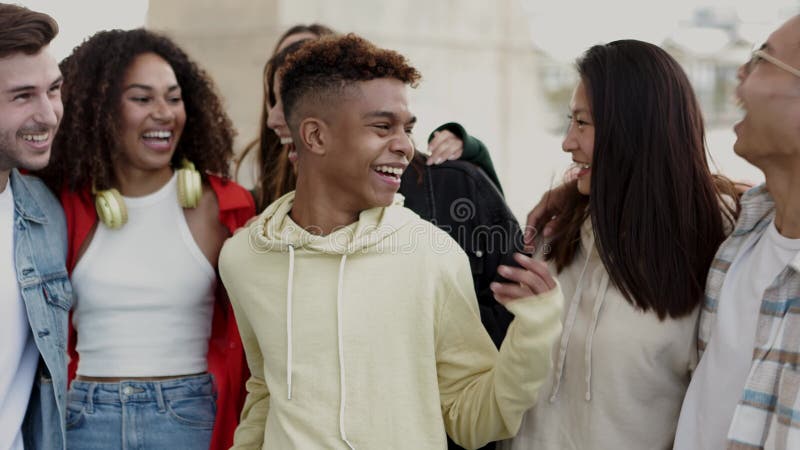 Multiracial Group Of Young Friends Having Fun Together Outdoors Stock