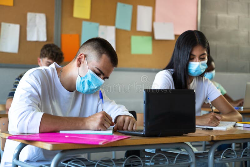 Multiracial High School Students Wearing a Face Mask in Class ...