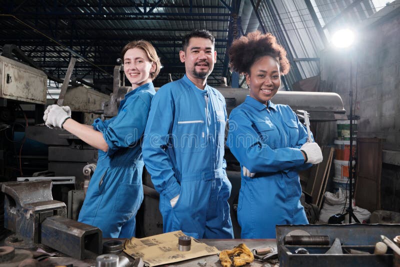 Multiracial Workers Collaborate and Express Happy Work in a Mechanical ...
