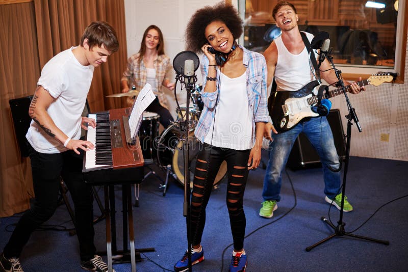 Multiracial Music Band Performing in a Recording Studio Stock Image ...