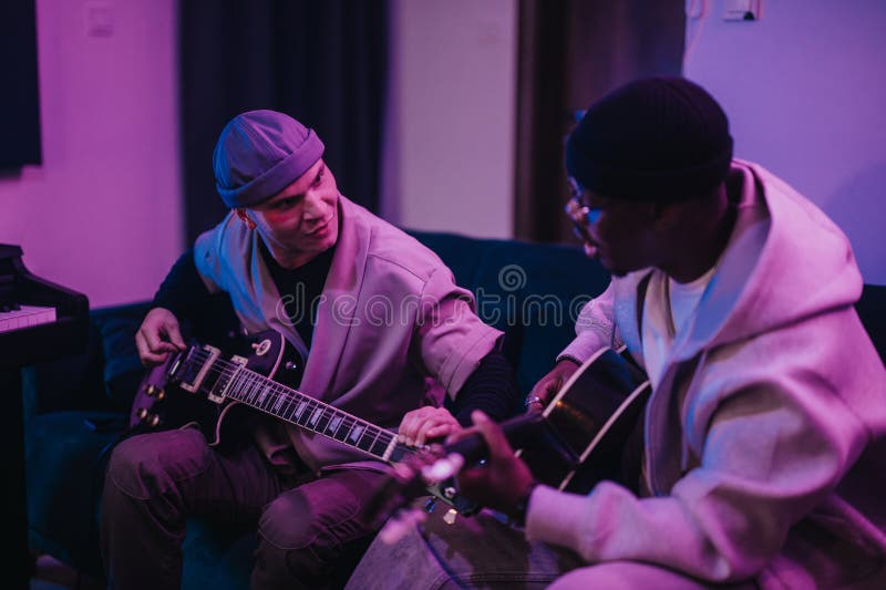 Multiracial Musicians Collaborate on Guitar and Piano in a Creative ...