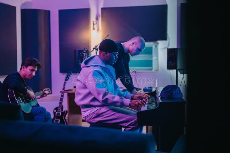 Multiracial Musicians Collaborating Modern Recording Studio Environment ...