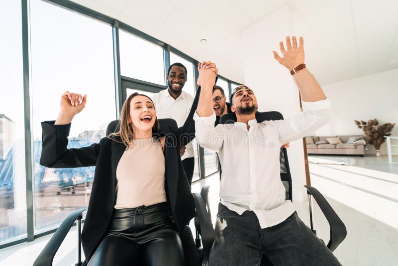 Multiracial Office Workers Having Fun Together in Office. Stock Photo ...
