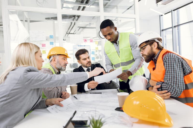 Multiracial People Brainstorming for Common Architecture Project Stock ...