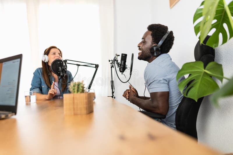 Multiracial People Recording a Podcast Using Microphone and Laptop from ...