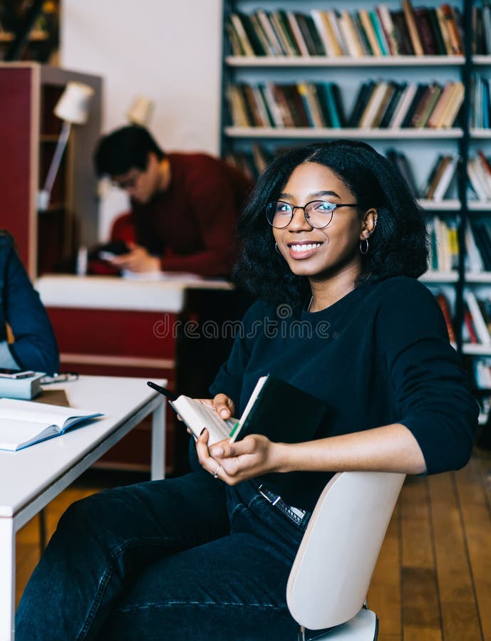 Multiracial Student Sitting at Table in Library Stock Image - Image of ...