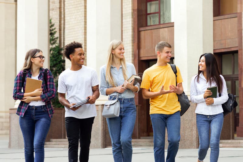 Multiracial Students Walking Against University Building during Break ...