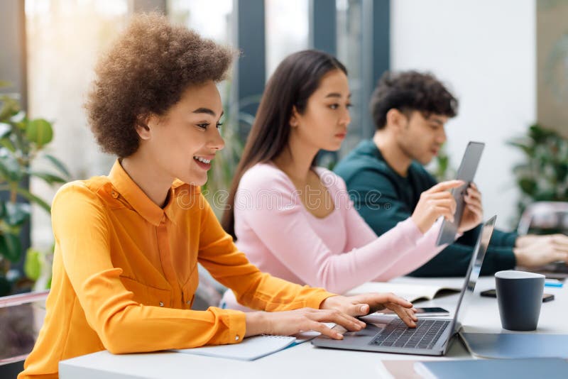 Multiracial Students Working on Laptops and Tablet Stock Photo - Image ...