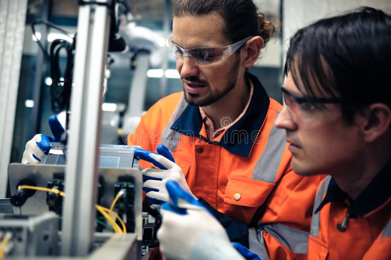 Multiracial Tachnicial Engineer Training with Robot Arm Stock Photo ...