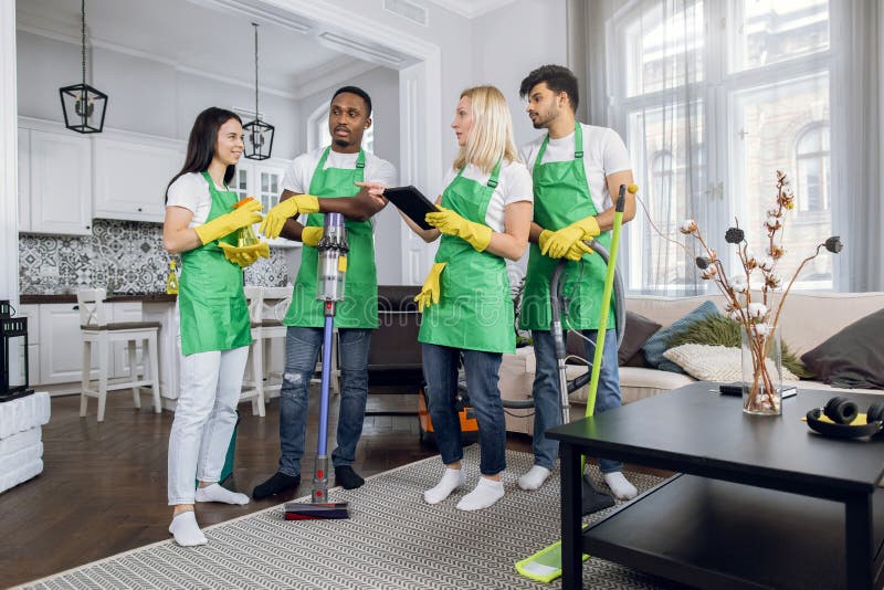 Multiracial Team of Cleaning Service Using Digital Tablet Stock Image ...
