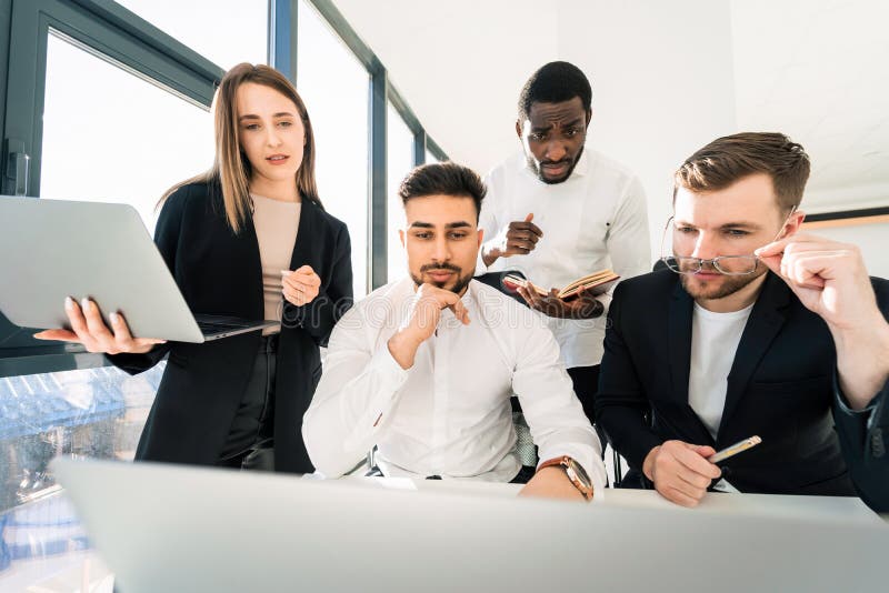 Multiracial Team of Programmers Working Together on a New Assignment ...