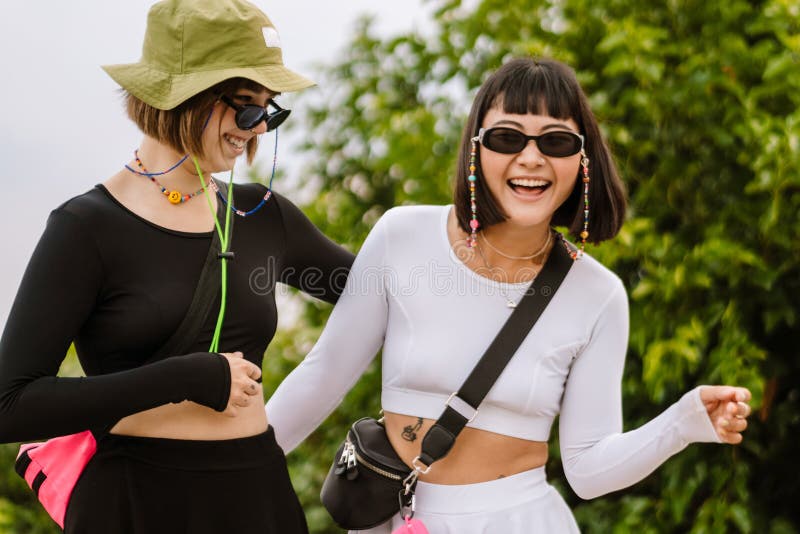 Multiracial Two Women Making Fun Together while Walking Stock Photo ...