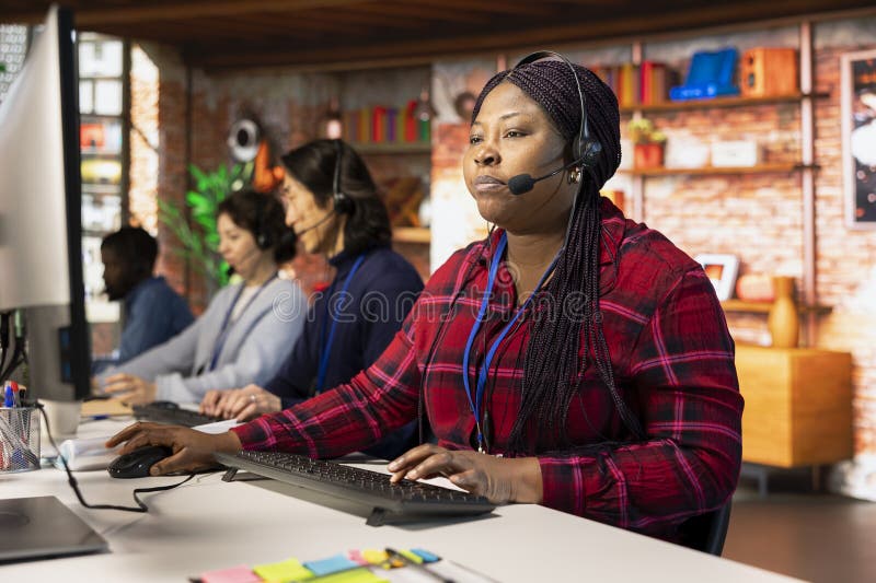 Multiracial Workers in Diverse Customer Center Assisting Clients Stock ...