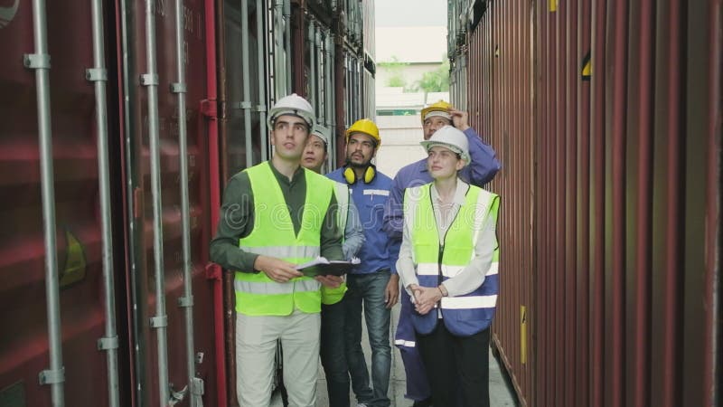 The Multiracial Workers Inspect Shipping Cargo at Nook of the Container ...