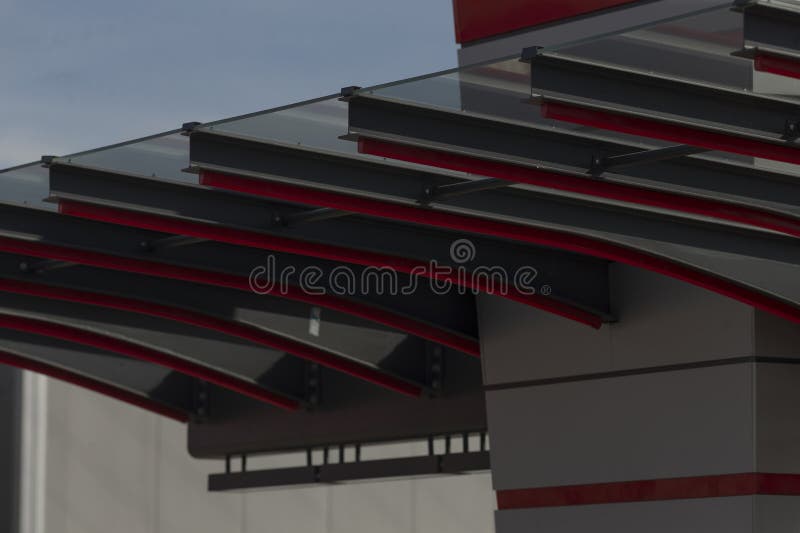 A Multistory Building Featuring a Stunning Glass Canopy Atop it Stock ...