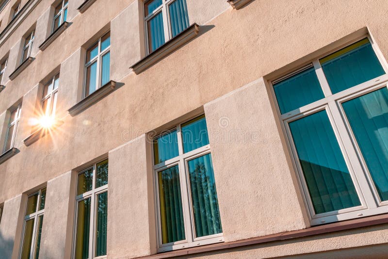 Multistory Building Wall with Sunlight in Windows Stock Photo - Image ...