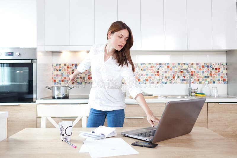 Multitasking woman at home stock photo. Image of cosy - 20049810
