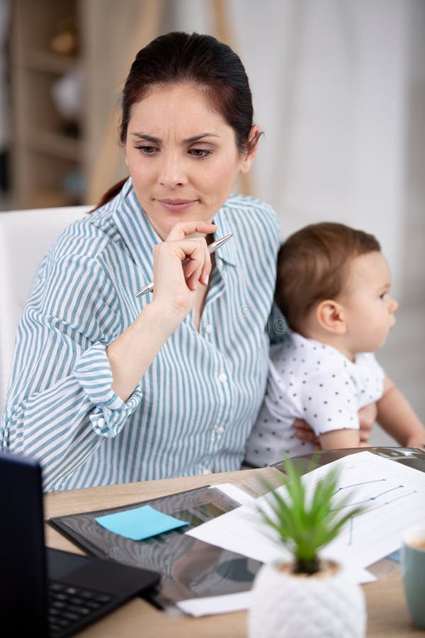 Multitasking Business Woman Sitting with Baby at Office Stock Image ...