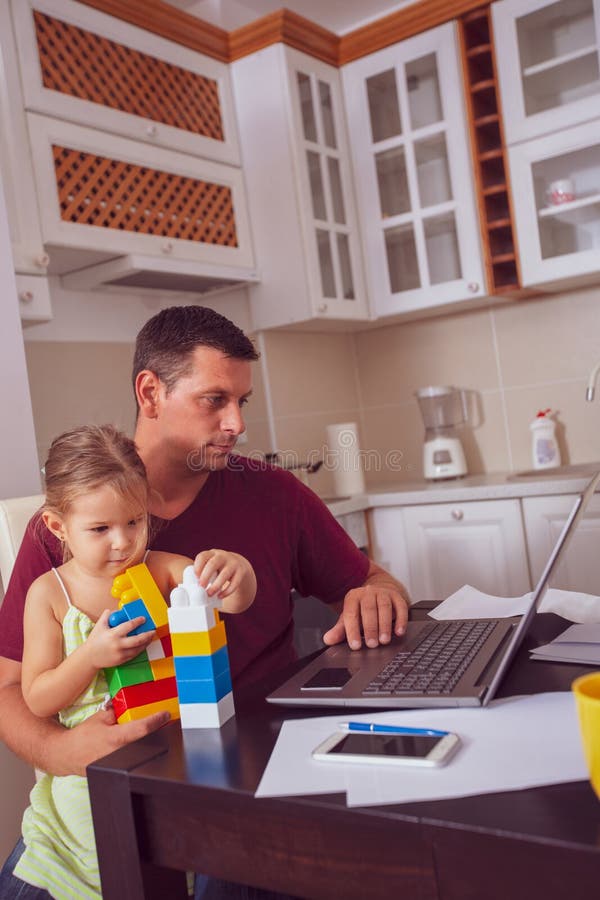 Multitasking Father is Babysitting and Working at Home Stock Photo ...