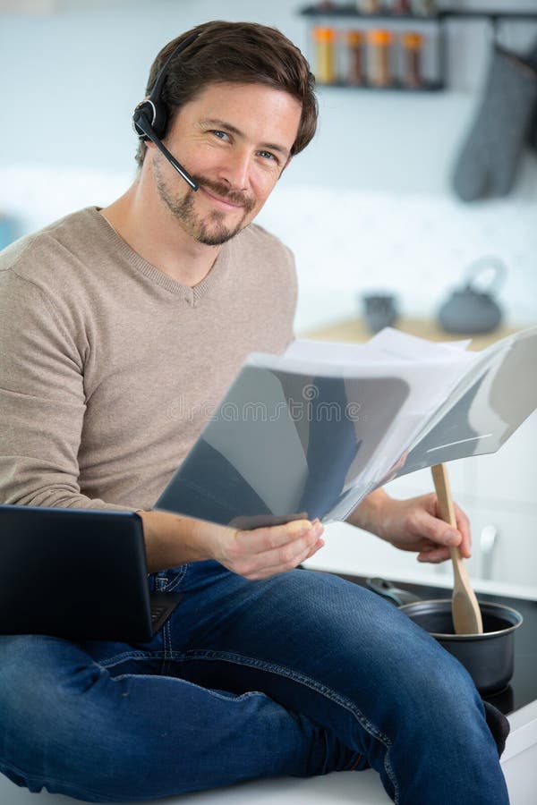 Multitasking Father Babysitting, Cooking Breakfast and Talking on Smart ...