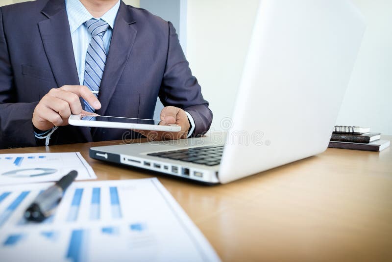 Multitasking. Handsome Young Man Working with Touchpad while Sit Stock ...