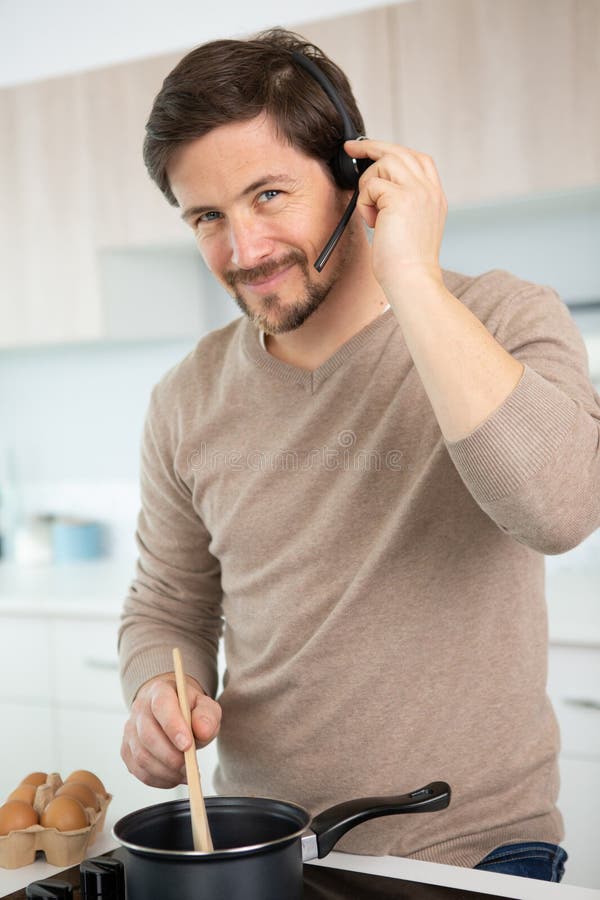 Multitasking Man Trying Working on Laptop and Cooking Stock Photo ...