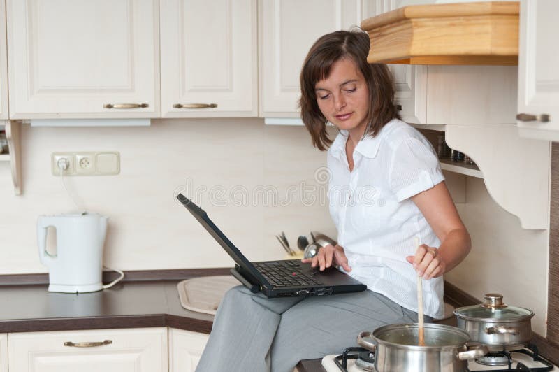 Multitasking Woman - Cooking Meal and Working Stock Image - Image of ...