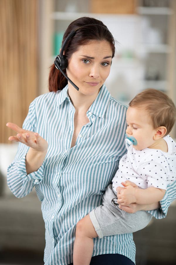 Multitasking and Stressed Businesswoman Working with Headset with Baby ...