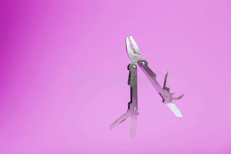 Multitool is a Multi-functional Tool on a Pink Background. the Concept ...