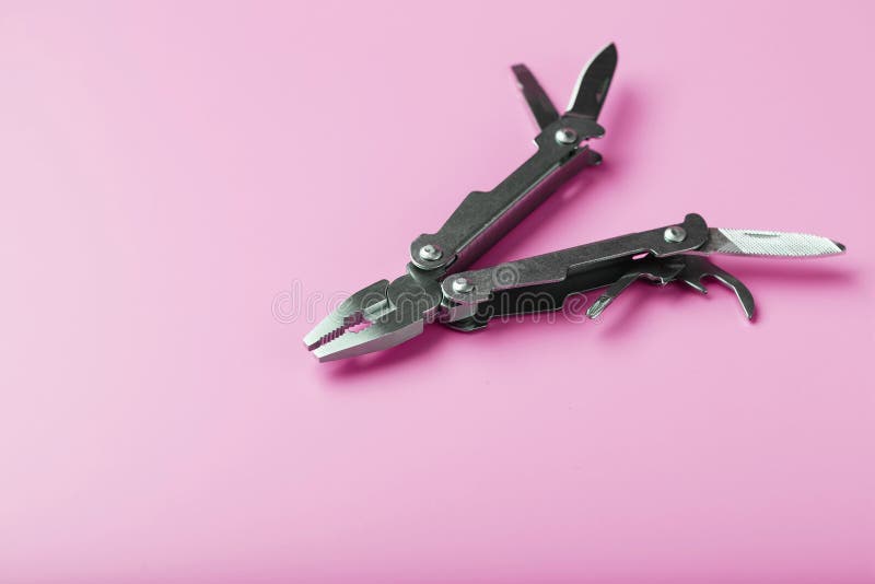 Multitool is a Multi-functional Tool on a Pink Background. the Concept ...