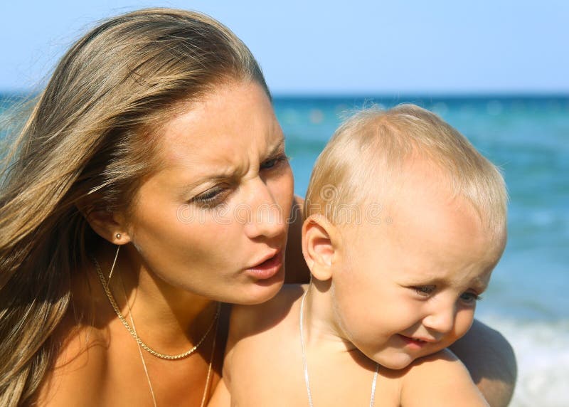 Mum with baby on sea stock photo. Image of inspires, blond - 36298276