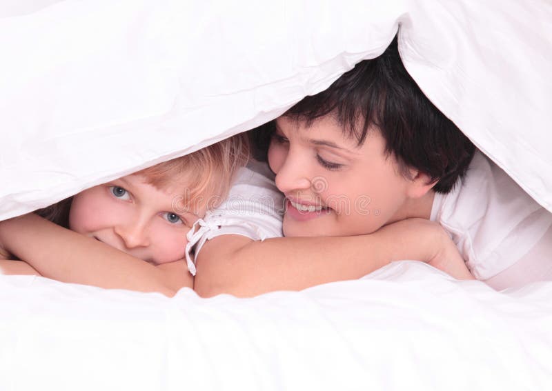Girls under Bed Sheets stock image. Image of smiling, lying - 3313445
