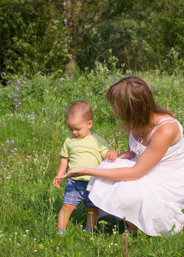 Mum and son stock image. Image of play, hand, green, blue - 2786381