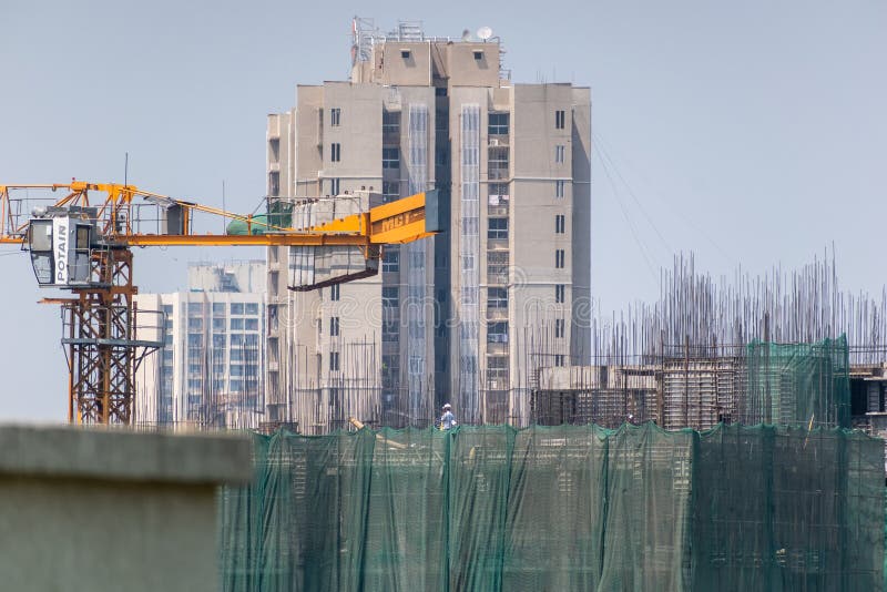 Workers Working on the Construction Site of a Skyscraper in the Suburb ...