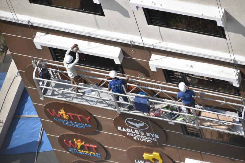 Construction Workers Fixing Light Tubes and Puncturing Holes Editorial ...