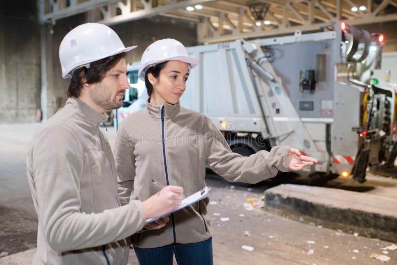 Municipal Workers Talking with Refuse Lorry in Background Stock Photo ...
