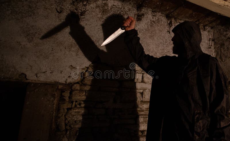 Murderer with Big Knife and Shadow Horror Scene Stock Photo - Image of ...