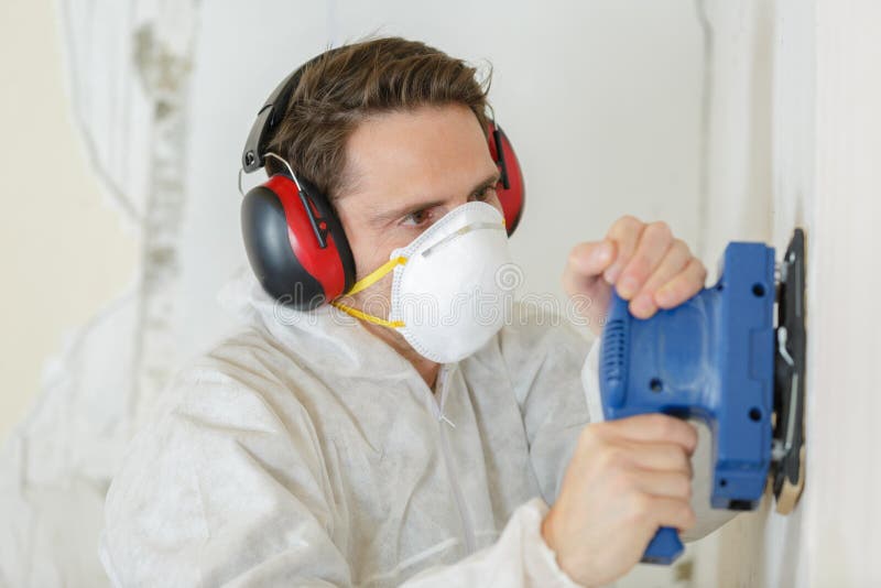 Muro De Lijado De Hombre Protegido De Constructores Foto de archivo ...