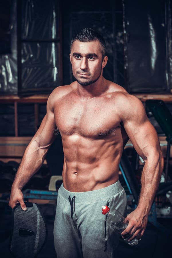 Muscle man who is posing stock photo. Image of muscular - 45782204